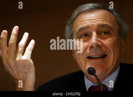 Italy's national anti-Mafia prosecutor Piero Grasso, left, shakes hands ...