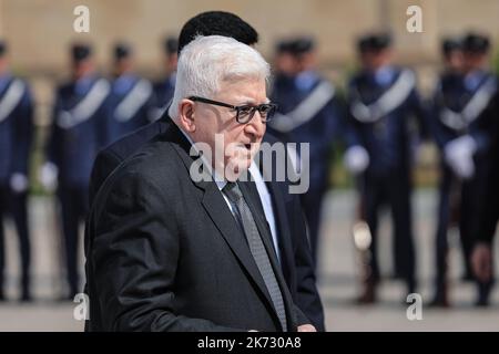 Former Iraqi President Fuad Masum, center, leaves the presidency ...