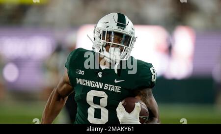 Michigan State running back Jalen Berger (8) breaks away from Wisconsin ...