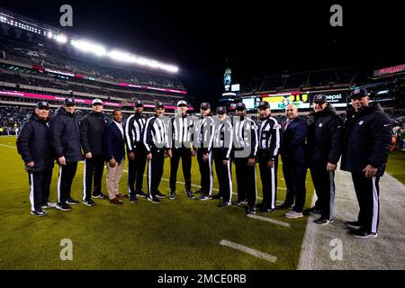 NFL officiating crew, including side judge Eugene Hall (103), umpire ...