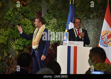 France's President Emmanuel Macron wearing a flower lei and seashell ...