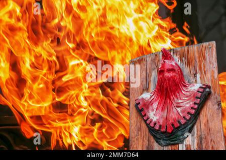 Le symbole d'un bourreau médiéval sur fond de houppes de feu orange ...