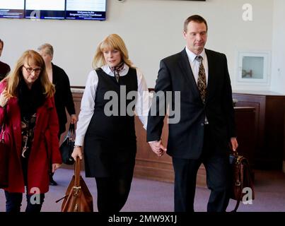 Curtis Lovelace walks with his wife, Christine, outside the courtroom ...