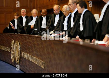 Judges, with presiding judge Ronny Abraham of France, second right, re ...