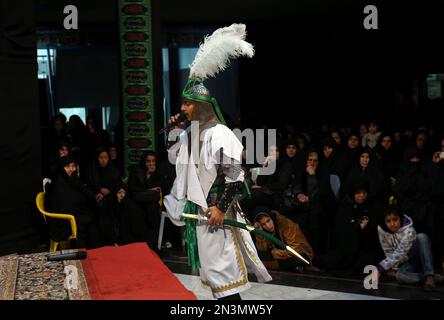 Iranian Mohammad Reza Rajabi, center, and Morteza Namaki perform in a ...