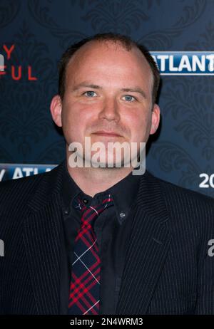 British actor Rory Kinnear poses for photographers for his award for ...