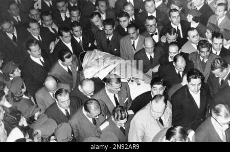 The casket bearing the body of Eva Peron is carried into the Labor ...
