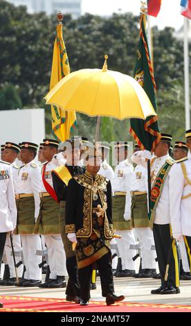 Malaysia's new King Sultan Abdul Halim, front left, Queen Haminah stand ...