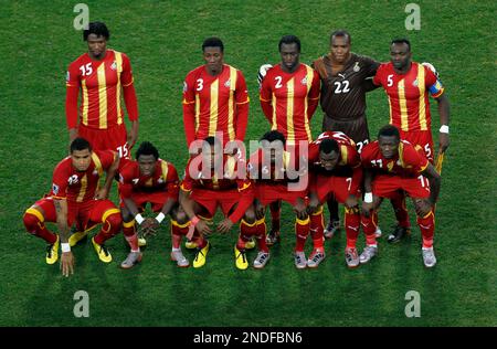 Ghana's John Mensah, front left, and Ghana's Asamoah Gyan, third from ...
