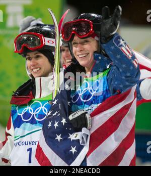 Canada's Jennifer Heil, left, of Spruce Grove, Alta., looks on as ...