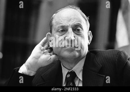 Outgoing U.S. Attorney General William B. Saxbe listens to a question ...