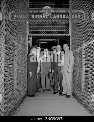 Secretary of the Army Robert Stevens, left, is ushered into a closed ...