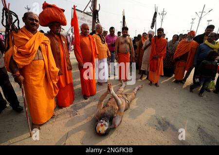 A Sadhu, or Hindu holy man Mauni Baba, offers prayers at the Sangam ...