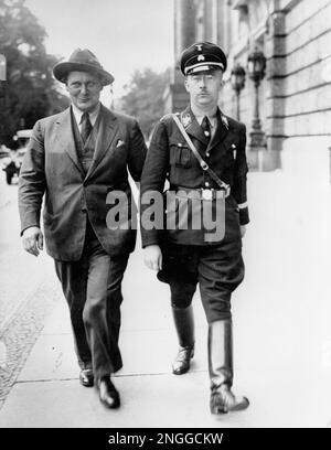 President of the Reichstag Hermann Goering, left, lifts his ...