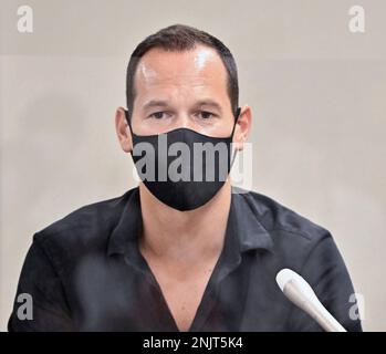 Vincent Fichot of France (C) attends a press conference after decision ...