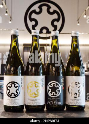 A photo shows bottles of sake (Japanese rice wine) in Higashikawa Town ...