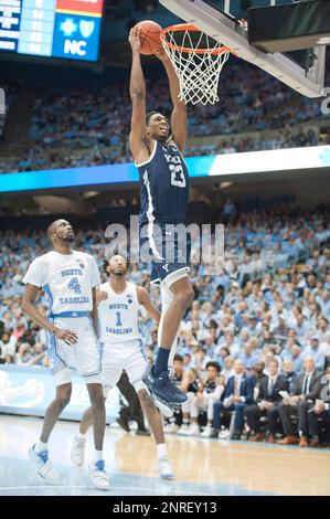 Cal Hill (30), Yale University back, runs after catching a long pass ...