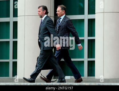 Businessman John Rallo leave federal court in St. Louis, Friday, May 10 ...