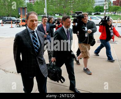 Businessman John Rallo leave federal court in St. Louis, Friday, May 10 ...