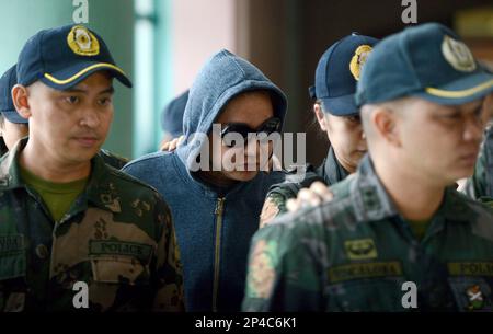 Janet Lim Napoles, center in sunglasses, a wealthy businesswoman at the ...