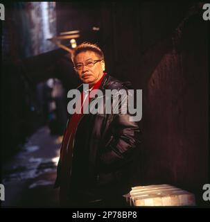 Hong Kong actor Ng Man Tat poses for photos in an alley in Kwun Tong ...