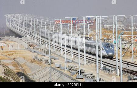 The CRH380A-6401L high speed train runs on a trail operation on the ...