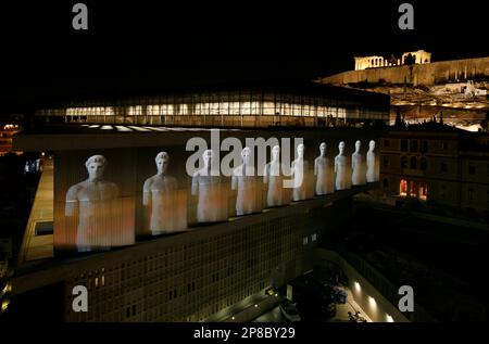 Photos of the so-called Kritios Boy statue are projected onto the walls ...