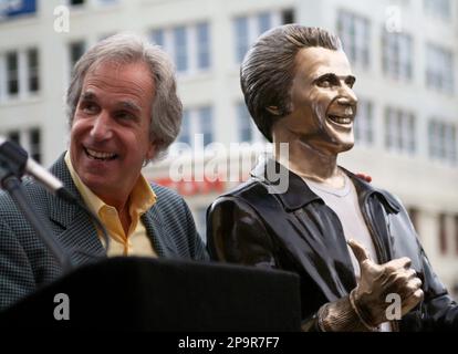 Actor Henry Winkler, left, poses with his sons Max Winkler, second left ...