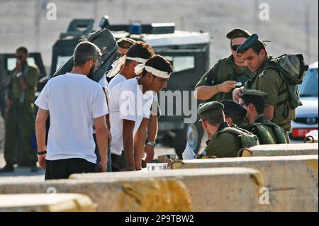 Palestinians, members of the Fatah-allied Hilles clan in Gaza, have ...