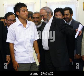 Iranian Deputy Foreign Minister Alireza Sheikh-Attar, right, shakes ...