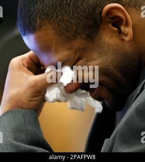 Former Canton patrolman Bobby Cutts Jr., left, talks with his attorney ...