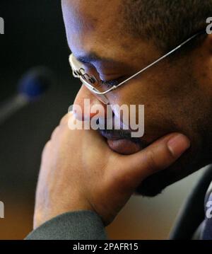 Former Canton patrolman Bobby Cutts Jr., left, talks with his attorney ...
