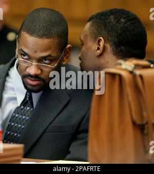 Former Canton patrolman Bobby Cutts Jr., left, talks with his attorney ...