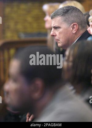 Former Canton police officer Bobby Cutts Jr., left, sits with attorney ...