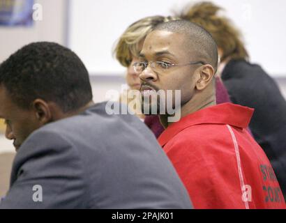 Former Canton police officer Bobby Cutts Jr., left, sits with attorney ...
