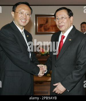 Philippine Foreign Affairs Secretary Alberto Romulo, right, accepts ...