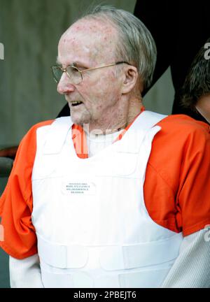 Reputed Ku Klux Klansman James Ford Seale, left, is assisted down steps ...