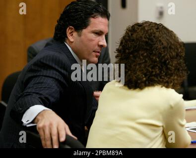 Defense attorney Joseph Tacopina, left, comforts Melanie McGuire after ...