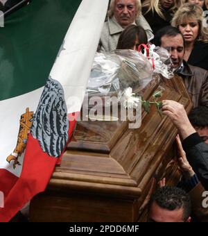 People greet the coffin of Romano Mussolini with fascist salutes ...