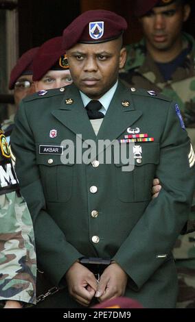 Sgt. Hasan Akbar, center, is led from the Staff Judge Advocate Building ...