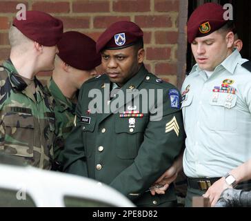 Sgt. Hasan Akbar, center, is led from the Staff Judge Advocate Building ...