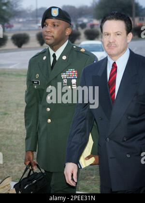 U.S. Army Sgt. Javal S. Davis, center, with his attorney Paul Bergrin ...