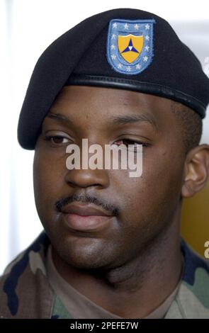 U.S. Army Sgt. Javal S. Davis, center, with his attorney Paul Bergrin ...
