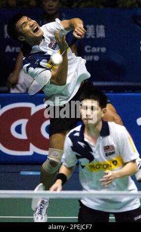 Malaysian shuttler Chew Choon Eng, top, and partner Choong Tan Fook ...