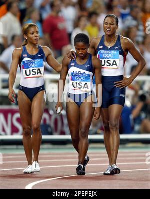 Latasha Colander, left, Lauryn Williams, center, and Marion Jones react ...