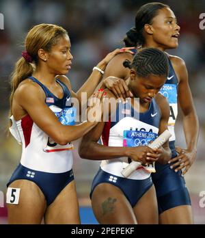 Latasha Colander, left, Lauryn Williams, center, and Marion Jones react ...