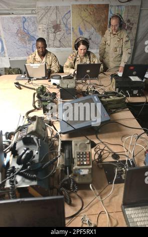 U.S. Army officers work inside the TOC (Tactical Operations Center) of ...