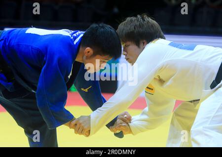 Abe Hifumi of Japan, right, and Joshiro Maruyama of Japan compete during their men's -66kg final ...