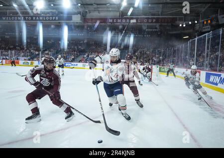 Kamloops Blazers' Ryan Hofer (10) vies for the puck against ...