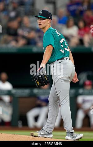 Seattle Mariners starting pitcher Bryan Woo winds up to throw to the ...